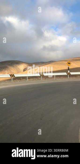 Paved road winds through the peruvian sierra, offering stunning views ...