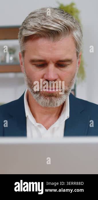 Close-up portrait face mature businessman gray hair freelancer at ...