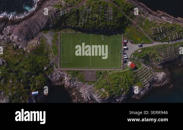 Aerial top down view of Henningsvaer pitch in Lofoten, Norway. Players ...