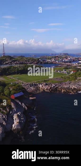 Aerial view of Lofoten Norway shows a coastal football pitch by a ...