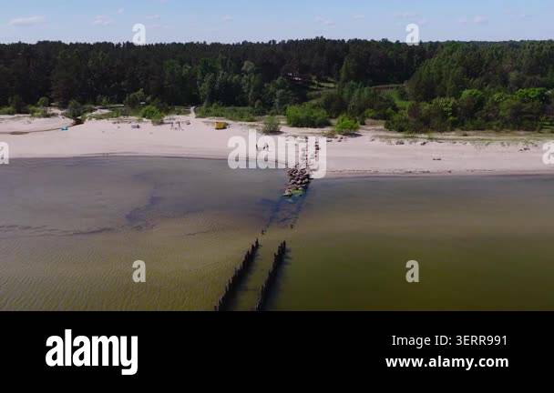 Aerial view of Jurmala, Latvia as pine forest meets sandy beach. Old ...