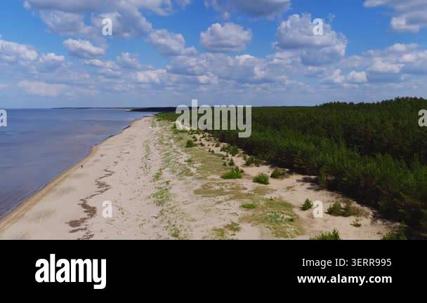 Aerial drone sweep travels parallel to Jurmala shoreline in Latvia ...