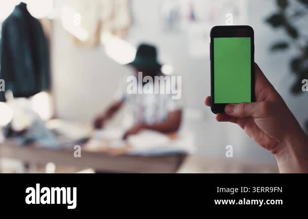 Close up view of a male hand using cell-phone and taking photo of a ...
