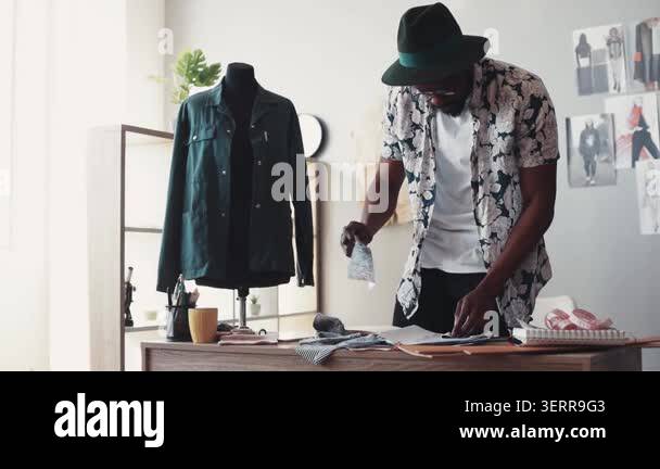 Close up view of a designer trying different types of fabric for the ...