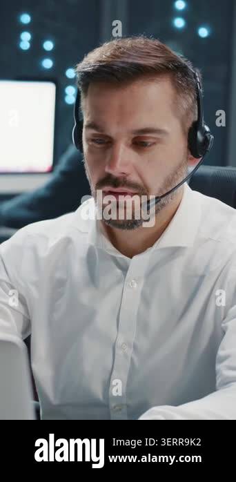 Footage of serious focused young handsome Caucasian man talking via ...