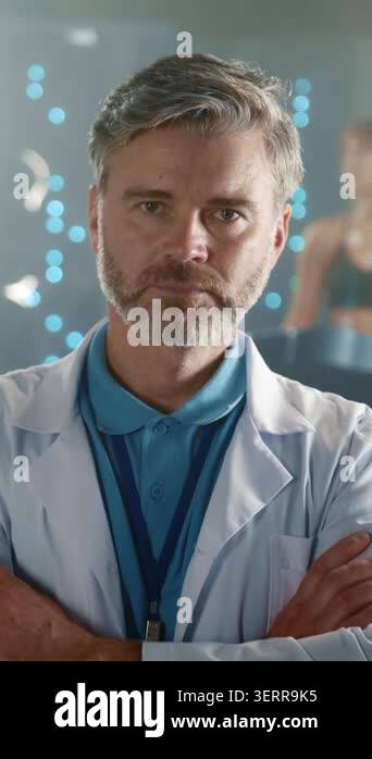 Portrait mature caucasian scientist crossing arms posing at server room ...