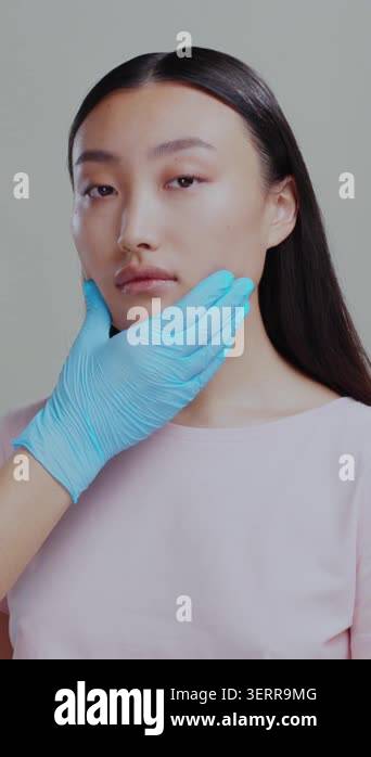 Slow motion clip - Doctor checks a skin before plastic surgery. Face ...