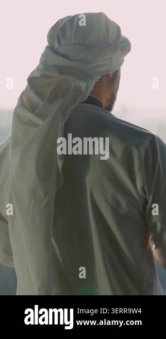 Arabic Adult Businessman Holding Papers Looking out of Window Planning ...