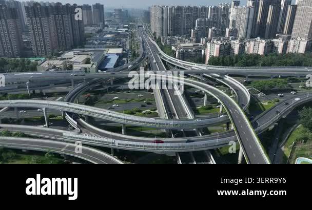 Aerial view of a complex highway interchange with cars driving on ...