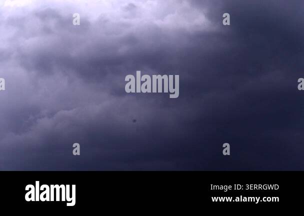 Dense dark monsoon clouds covering the sky before heavy rainfall ...