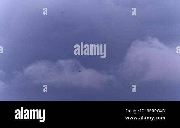 Thick monsoon cloud formations drifting across the sky before rainfall ...