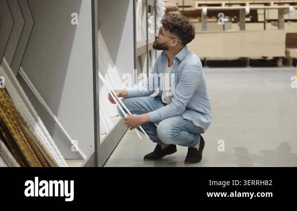 Young man choosing crown molding in hardware store Stock Video Footage ...