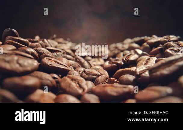Roasted coffee beans, dark background, sliding view Stock Video Footage ...