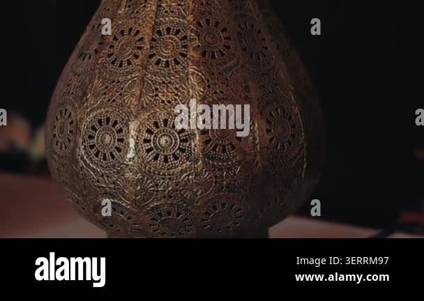 Close up of a vintage moroccan metal lamp with intricate patterns. Cozy ...