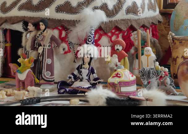Detailed composition of handcrafted felt dolls in traditional Kyrgyz ...