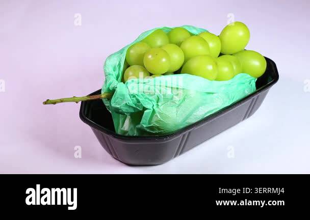 Shine Muscat Grapes in a Plastic Tray Rotating on a White Background ...