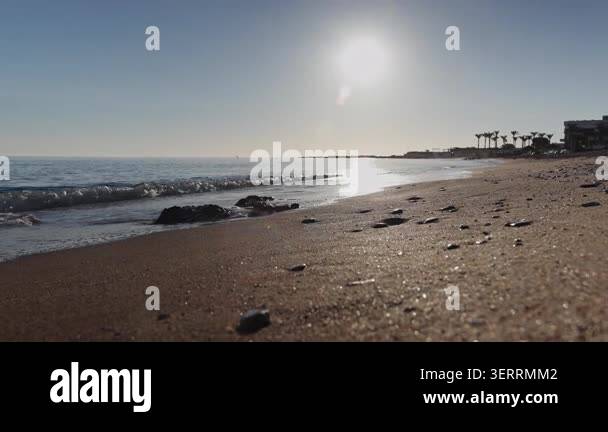Panning video shot from Kato Gouves beach in Crete at sunrise, showing ...