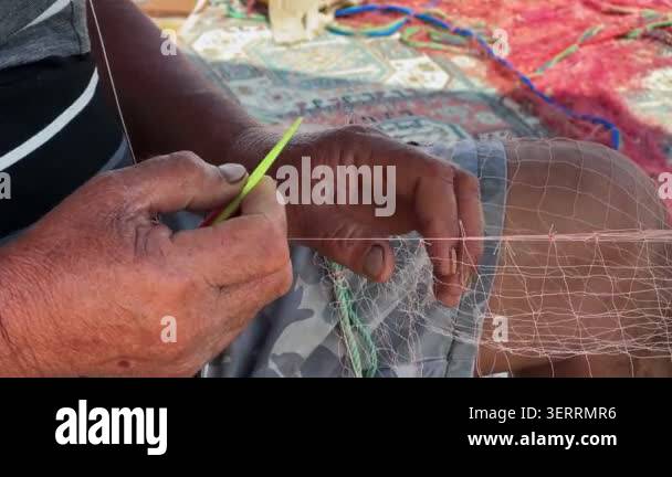 Fisherman is Repairing Fishnets Fishing Lines Stock Video Footage - Alamy