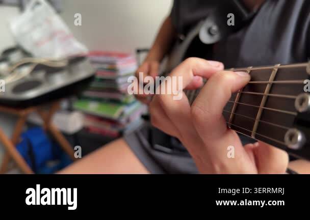 Young Girl Hand is Playing Guitar Instrument Stock Video Footage - Alamy