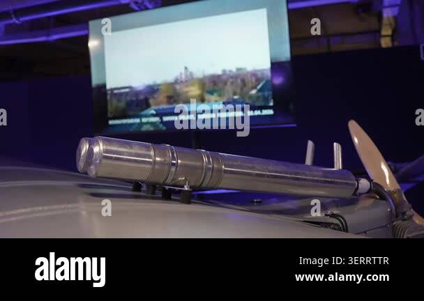Close-up of a metallic cylindrical object mounted on a surface, with a ...