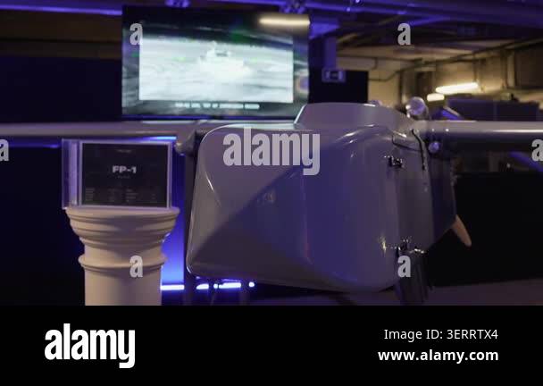 Close-up of a white drone component with a screen displaying a ...