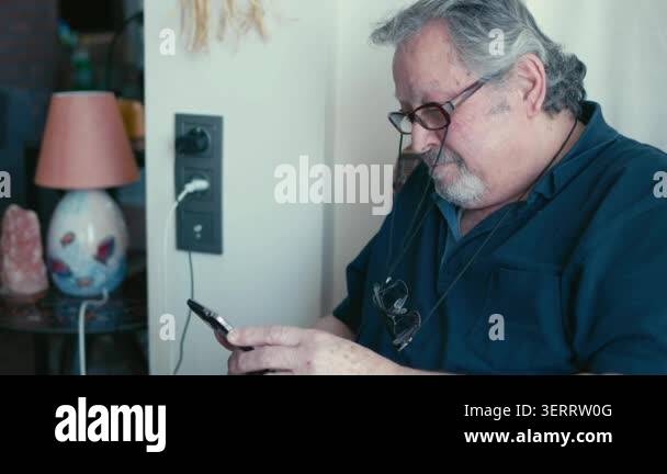 Elderly Old Man is looking to Cellphone Stock Video Footage - Alamy