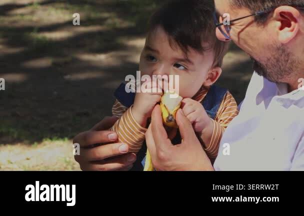 Adorable toddler in a natural outdoor setting enjoying a family ...