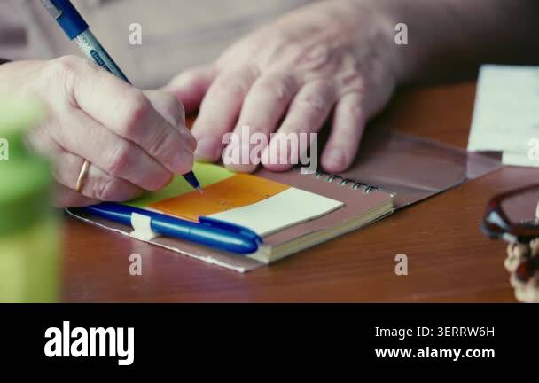 Elderly Old Man is taking Notes on Paper Stock Video Footage - Alamy