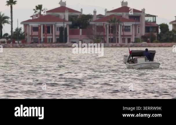 Fishing Boat in the Sea and Houses in City Izmir Turkey Stock Video ...