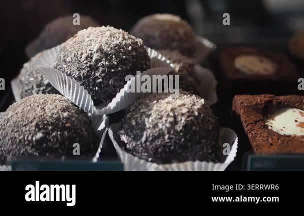 Bakery display shows tasty desserts and treats with chocolate and ...