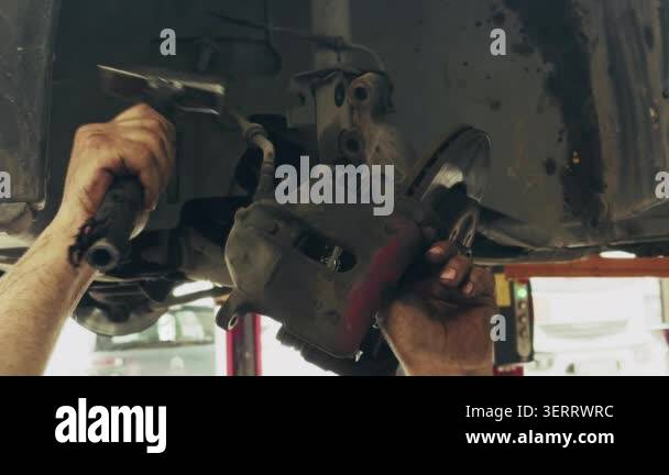Repairing a Car Wheel at the Mechanic Place Stock Video Footage - Alamy