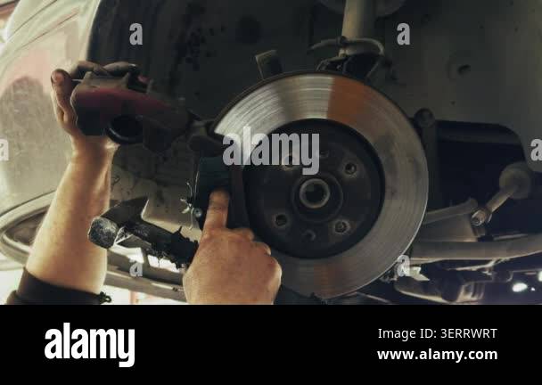 Repairing a Car Wheel at the Mechanic Place Stock Video Footage - Alamy