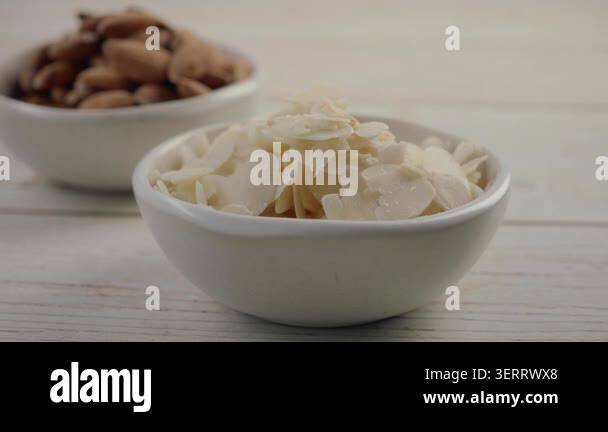 Close-up of Flaked Almonds with Whole Almonds in Background Stock Video ...