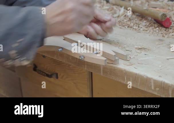 A person works on wooden tools using simple hand techniques Stock Video ...