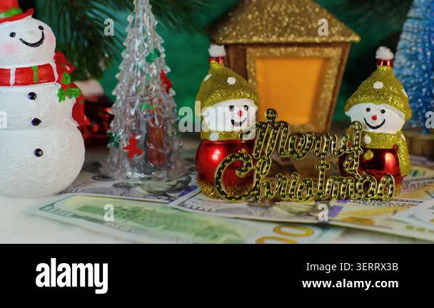Snowmen with letters and dollar bills against the background of ...