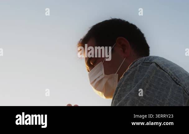 Man with Protecting Mask Praying for Health with Holding Christianity ...
