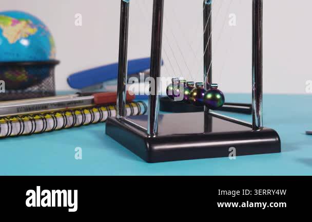 Educational Concept Newtons Cradle and School Office Equipment Tools ...