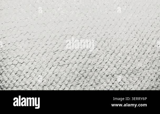 macro tracking shot reveals white textured fabric shifting under soft ...