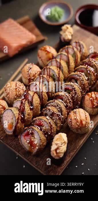 Close-up of delicious Japanese sushi rolls served fresh on a plate in a ...