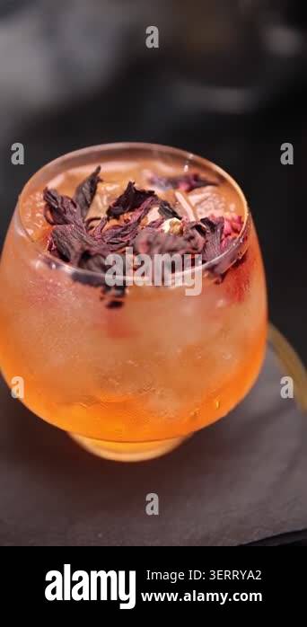 Bartender preparing a signature cocktail in a stylish moody bar Stock ...