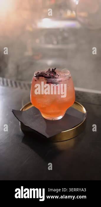 Bartender preparing a signature cocktail in a stylish moody bar Stock ...