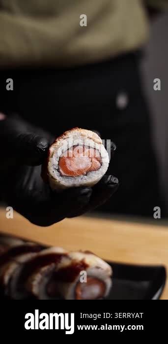 Close-up of delicious Japanese sushi rolls served fresh on a plate in a ...