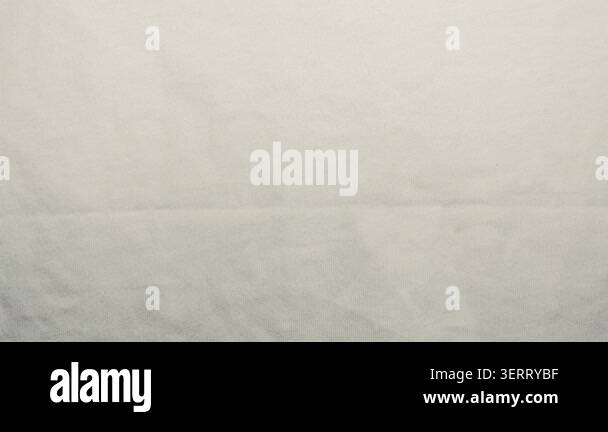 white linen fabric ripples gently in macro slow motion showcasing ...