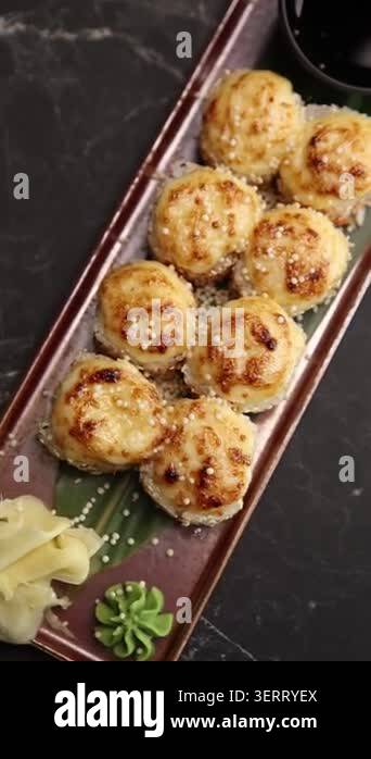 Close-up of delicious Japanese sushi rolls served fresh on a plate in a ...