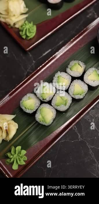 Close-up of delicious Japanese sushi rolls served fresh on a plate in a ...