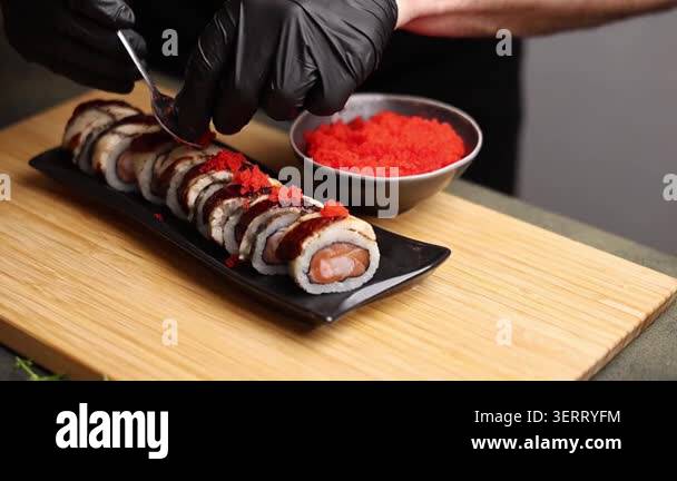 Close-up of delicious Japanese sushi rolls served fresh on a plate in a ...