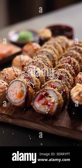 Close-up of delicious Japanese sushi rolls served fresh on a plate in a ...
