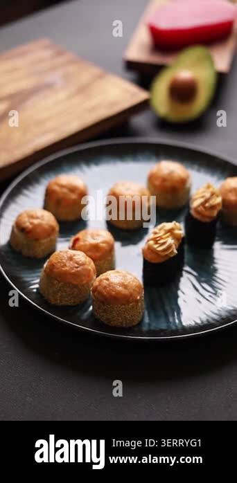 Close-up of delicious Japanese sushi rolls served fresh on a plate in a ...