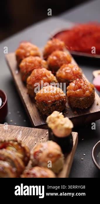 Close-up of delicious Japanese sushi rolls served fresh on a plate in a ...