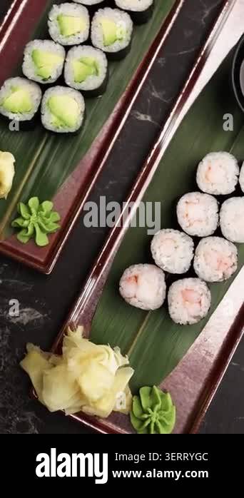 Close-up of delicious Japanese sushi rolls served fresh on a plate in a ...